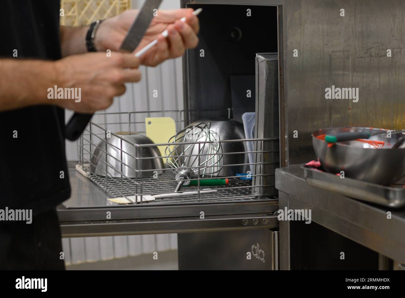 staff cleaning professional cook appliances and ware in professional ...