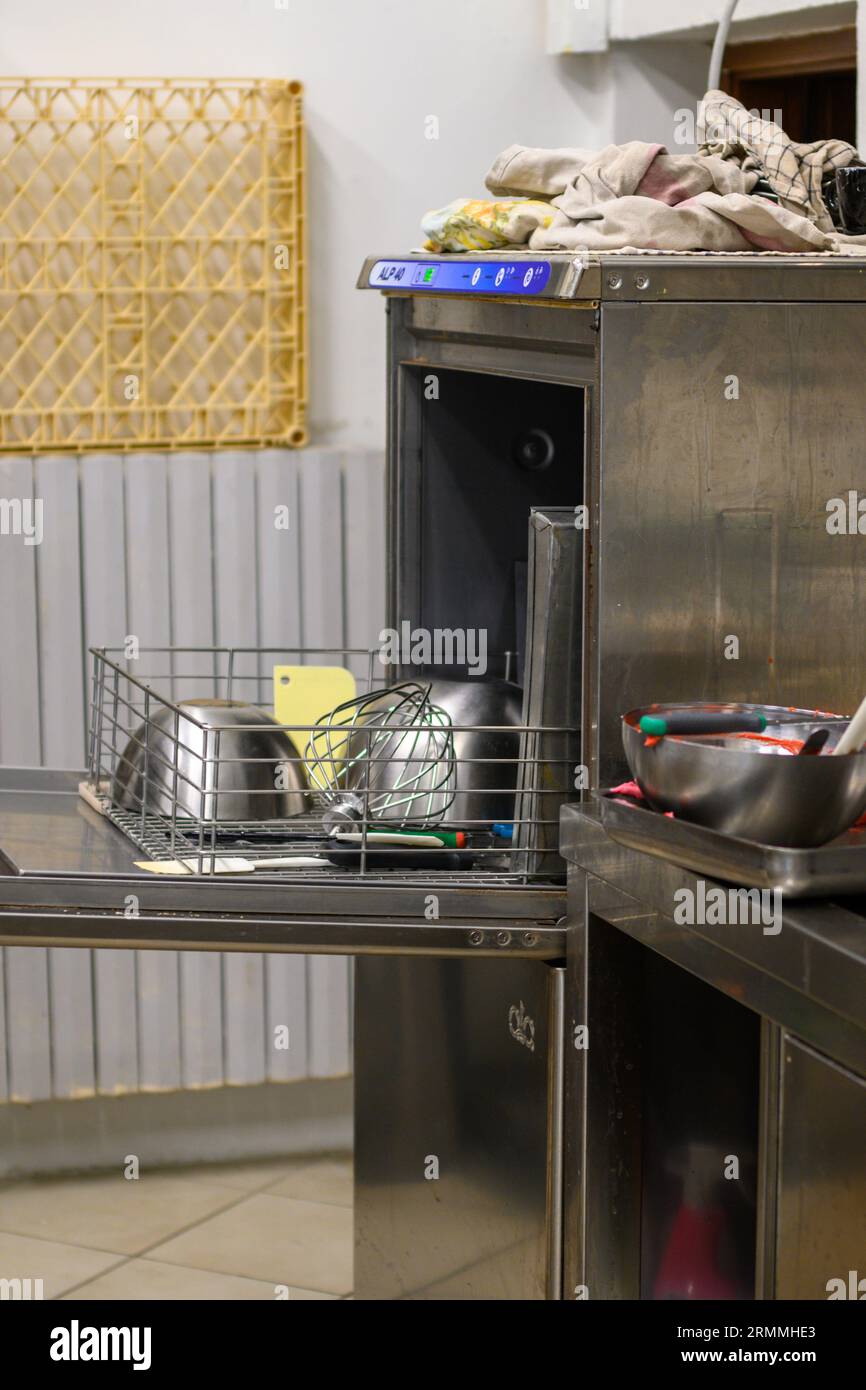 staff cleaning professional cook appliances and ware in professional ...