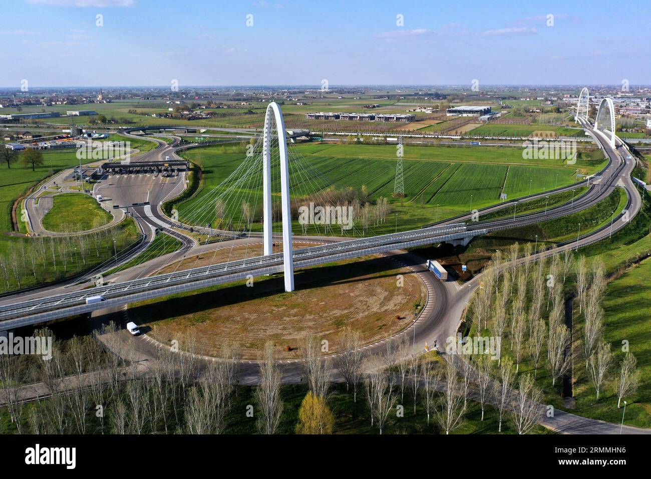 Aerial zenithal view of a roundabout with an arch of the suspension ...
