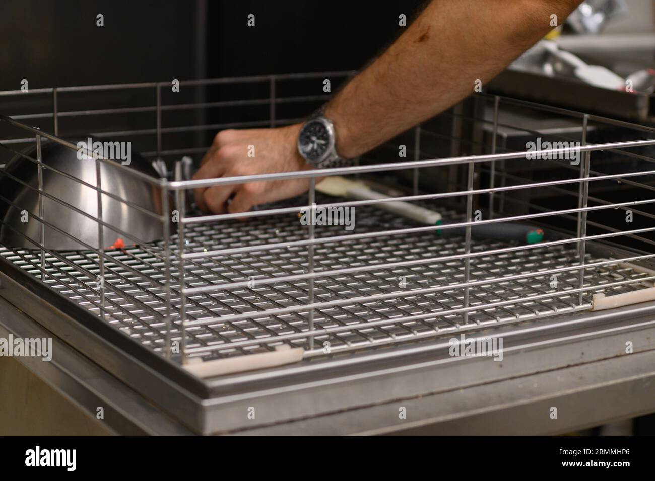 staff cleaning professional cook appliances and ware in professional ...