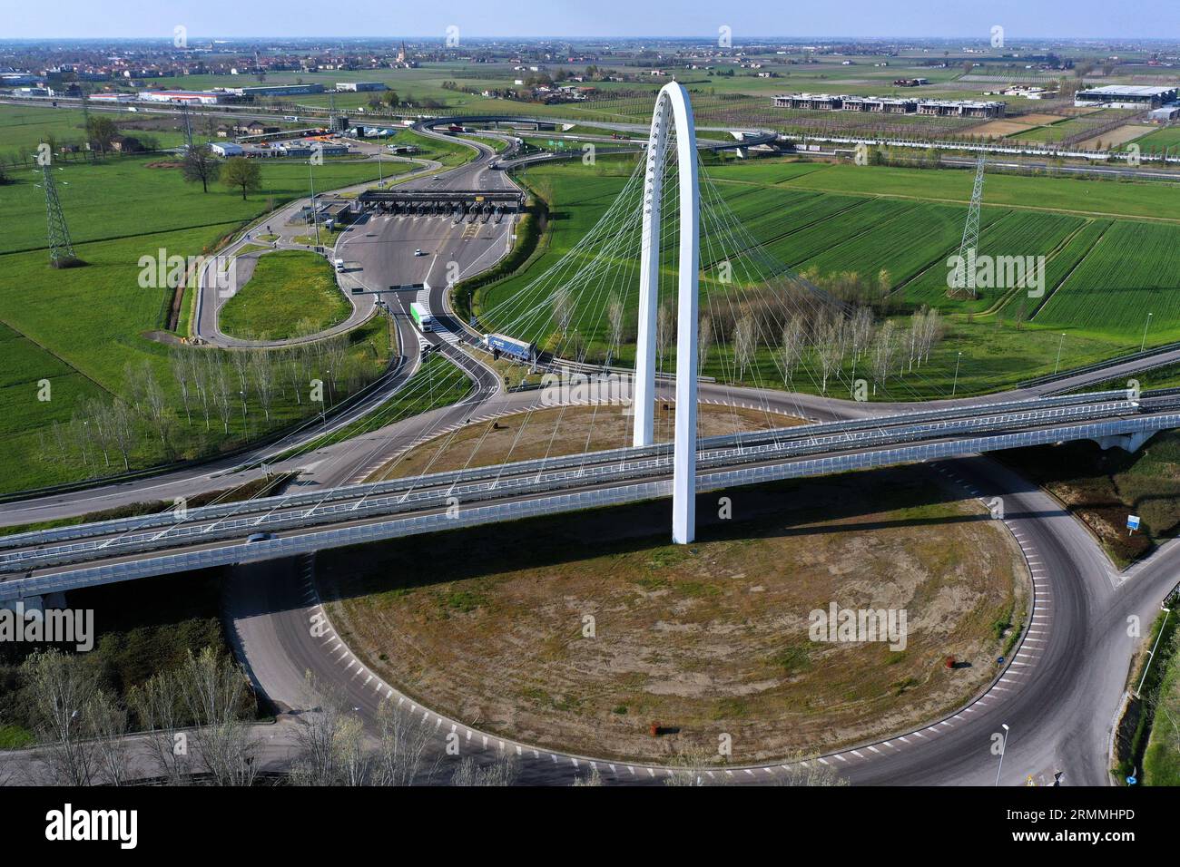 Aerial zenithal view of a roundabout with an arch of the suspension ...