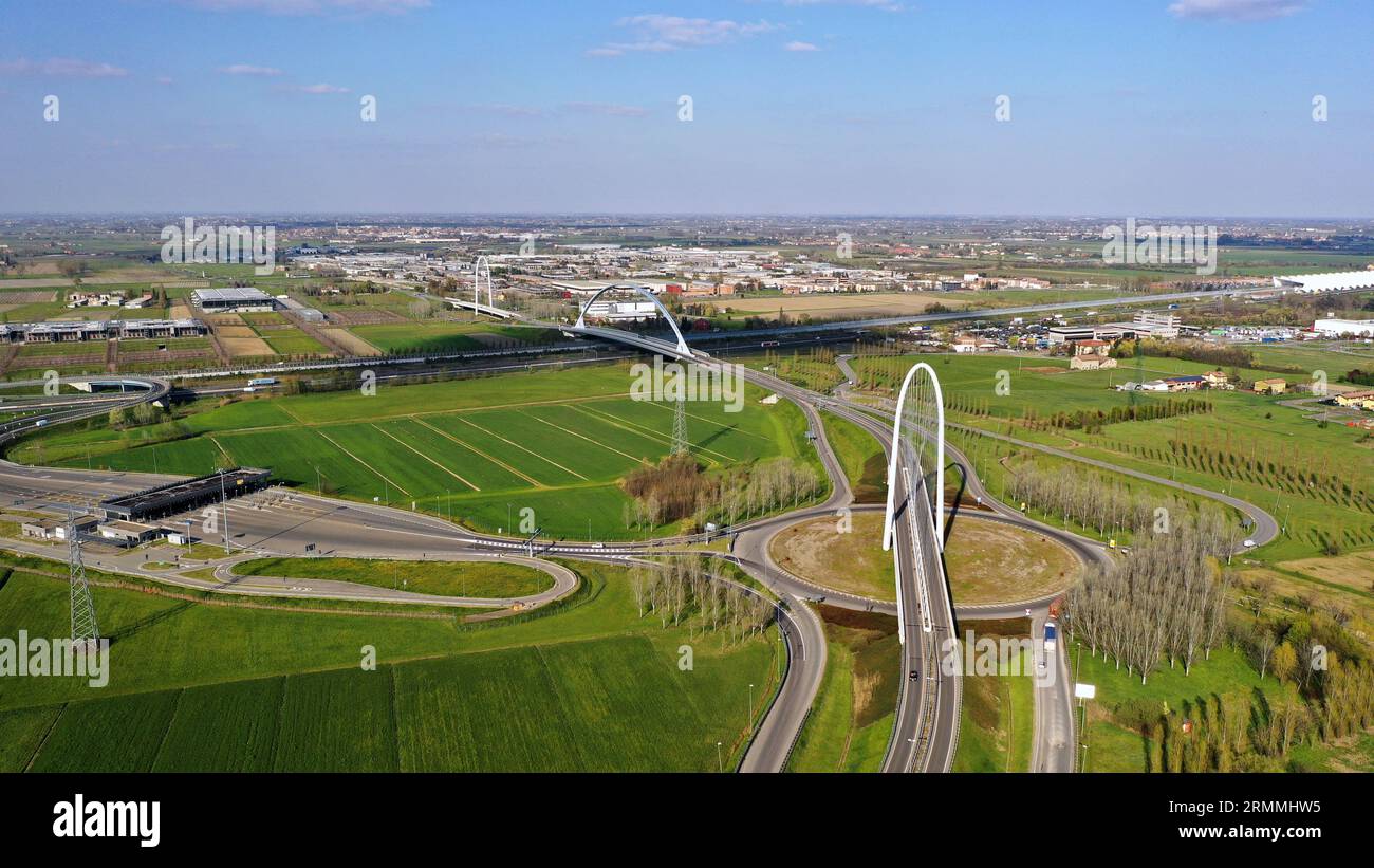 Aerial zenithal view of a roundabout with an arch of the suspension ...