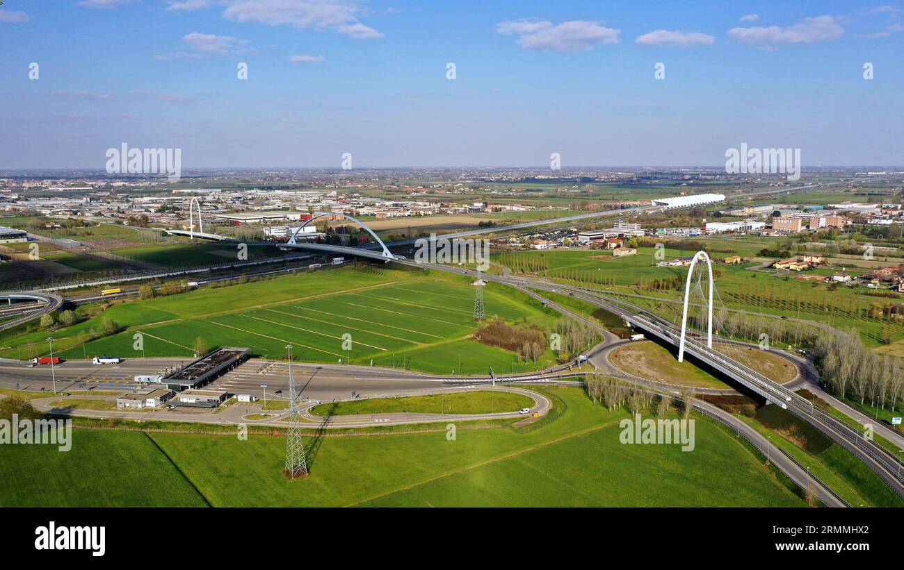 Aerial zenithal view of a roundabout with an arch of the suspension ...