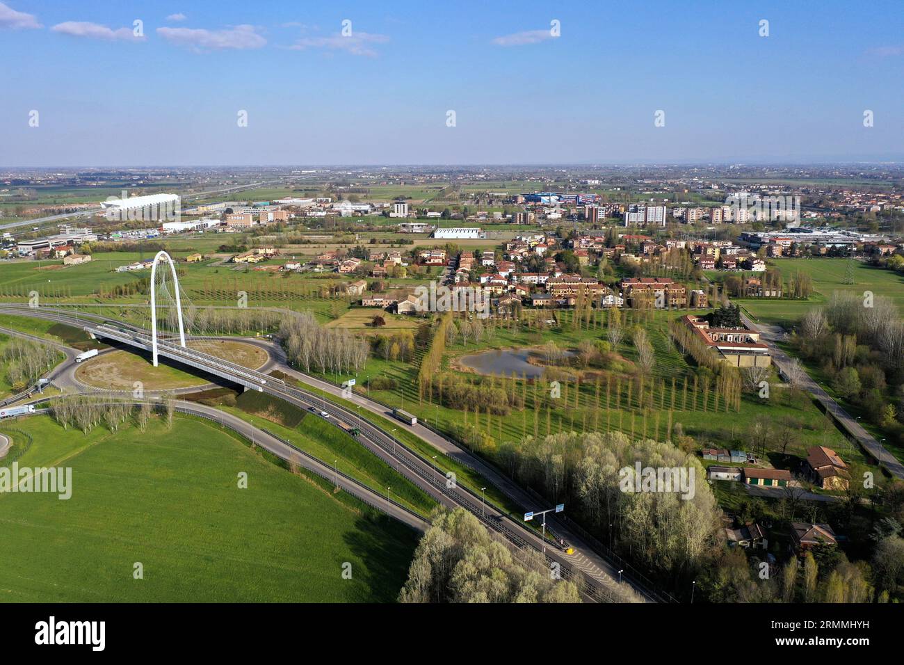 Aerial zenithal view of a roundabout with an arch of the suspension ...