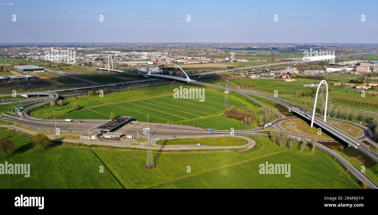Aerial zenithal view of a roundabout with an arch of the suspension ...