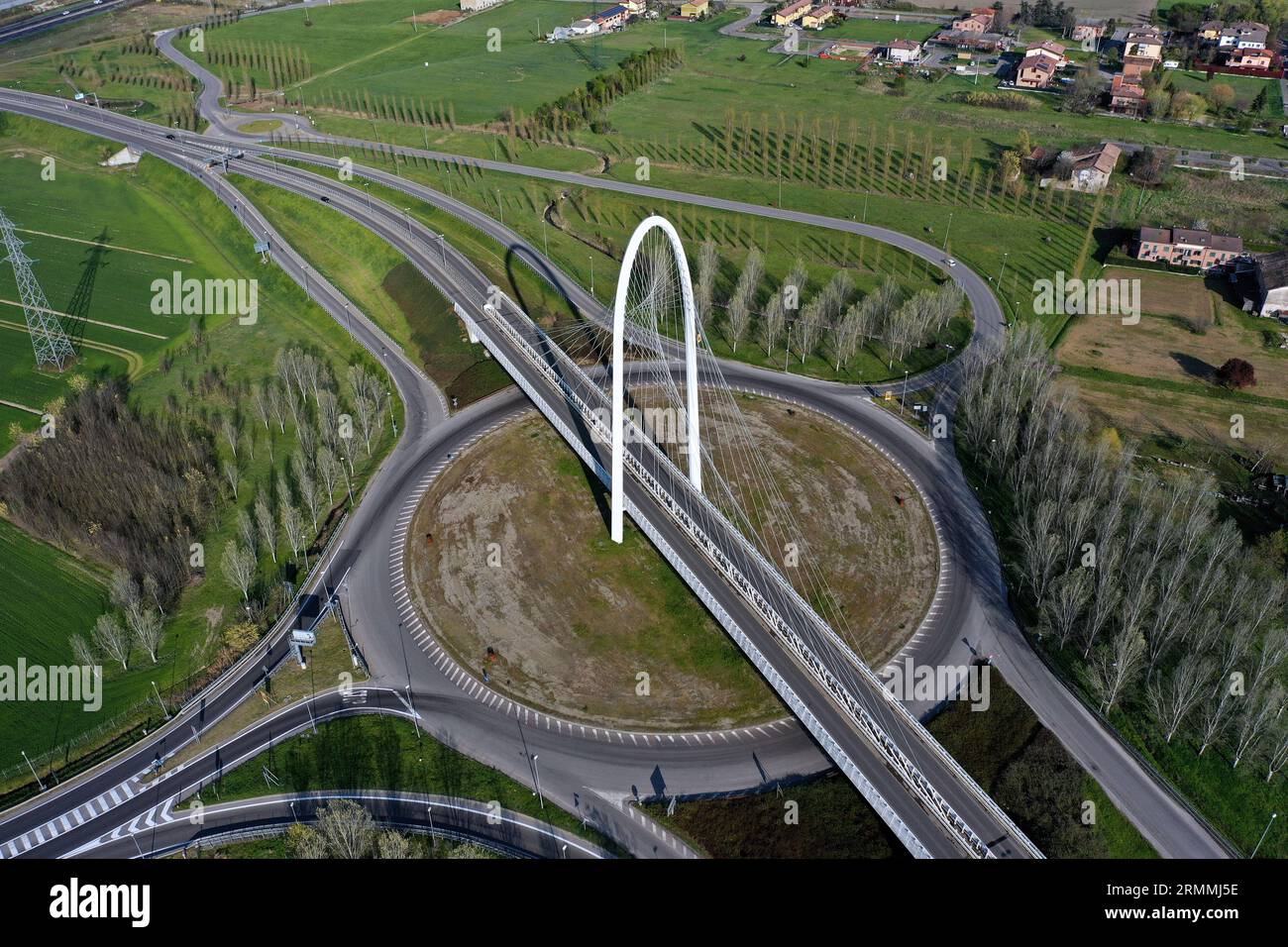 Aerial zenithal view of a roundabout with an arch of the suspension ...