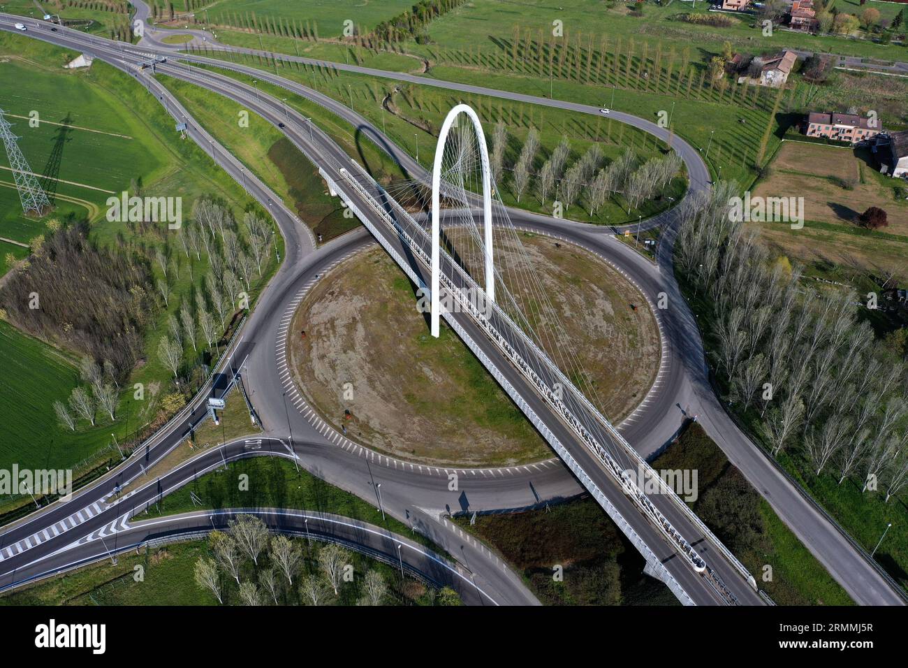 Aerial zenithal view of a roundabout with an arch of the suspension ...