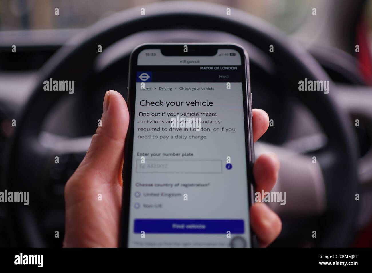 A person checks their vehicle on the Transport for London (TfL) webiste ...