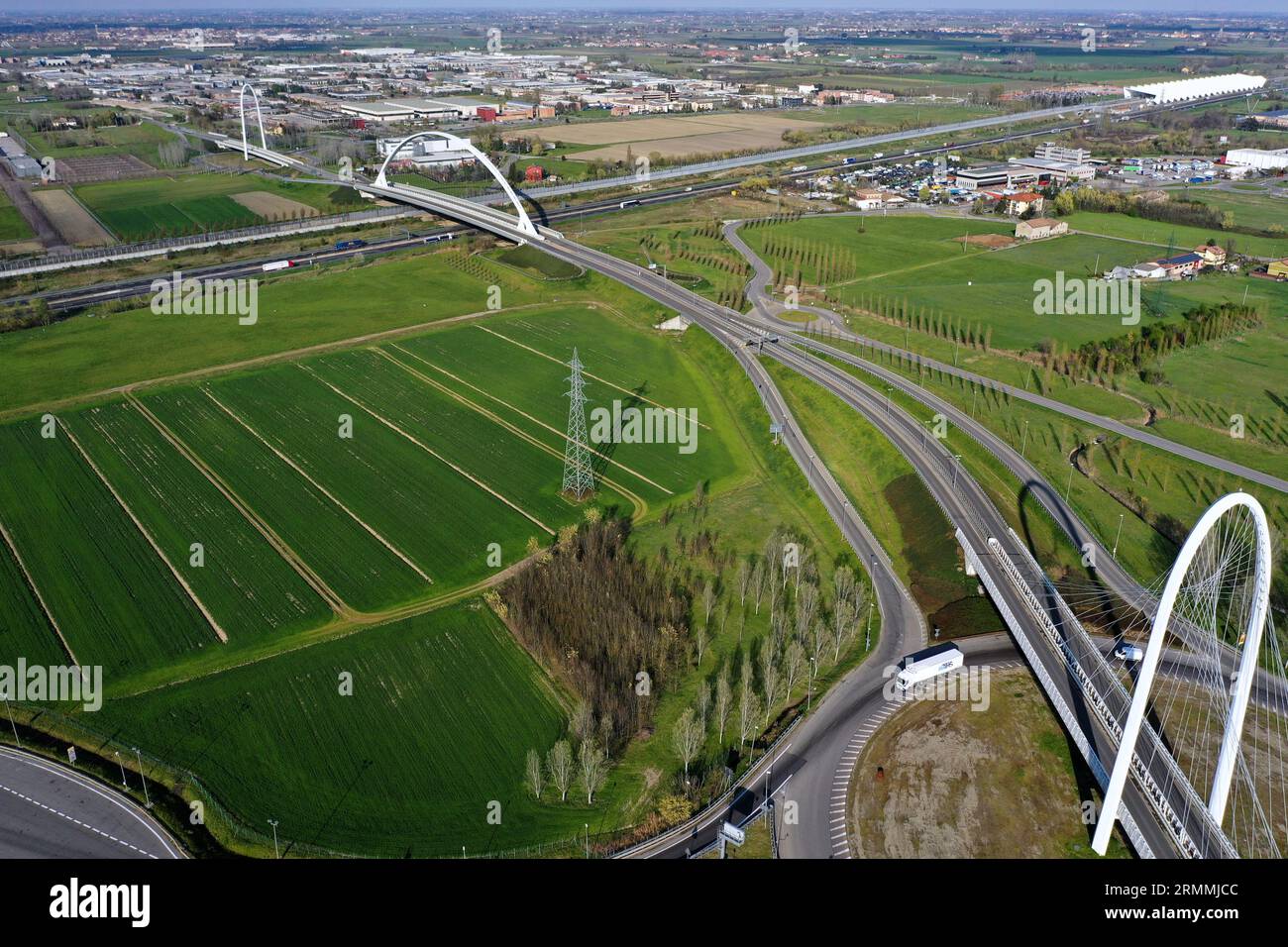 Aerial zenithal view of a roundabout with an arch of the suspension ...