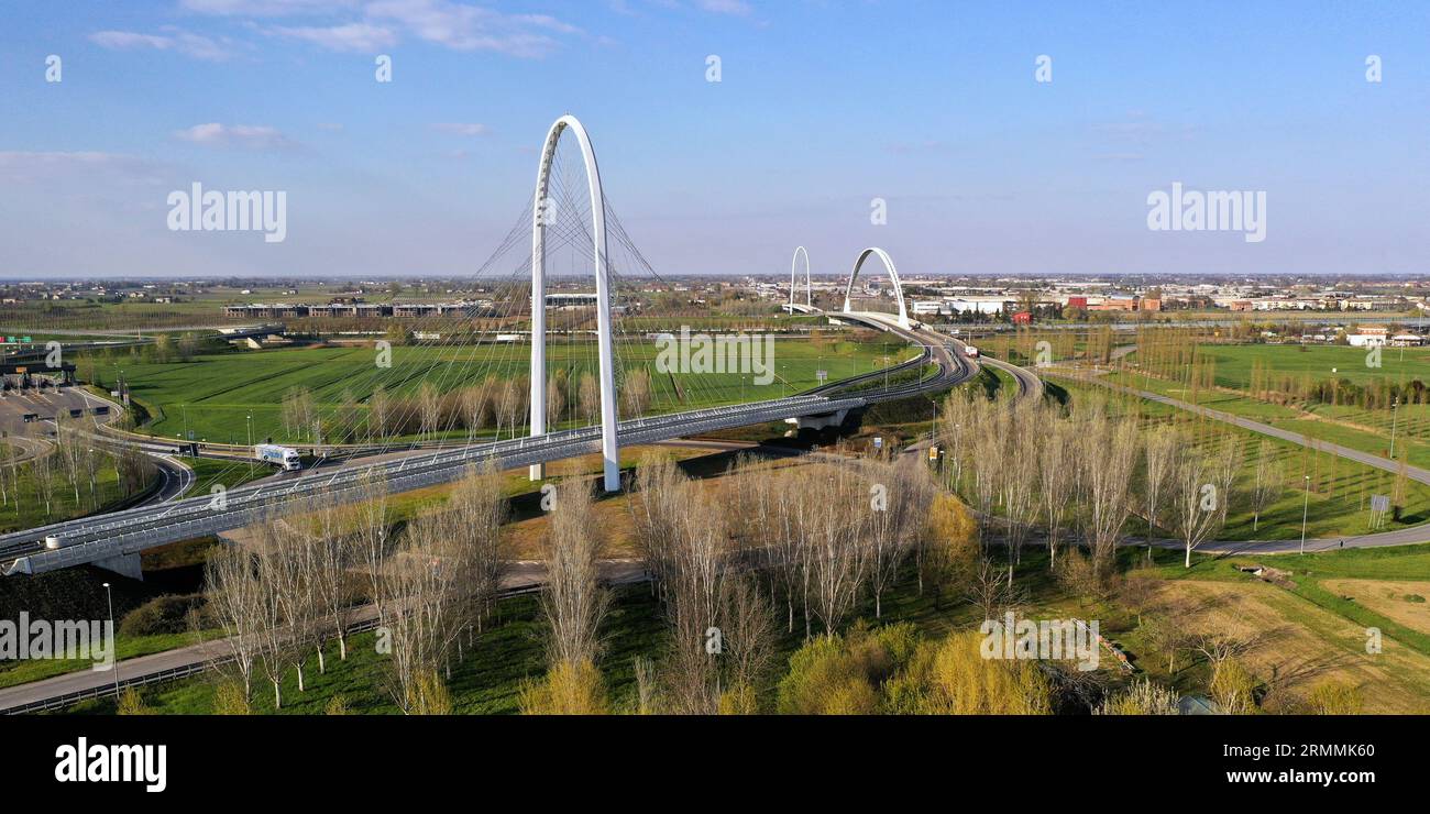 Aerial zenithal view of a roundabout with an arch of the suspension ...