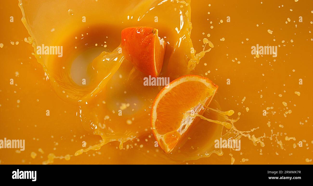 Orange, citrus sinensis, Fruit falling into Orange Juice Stock Photo ...