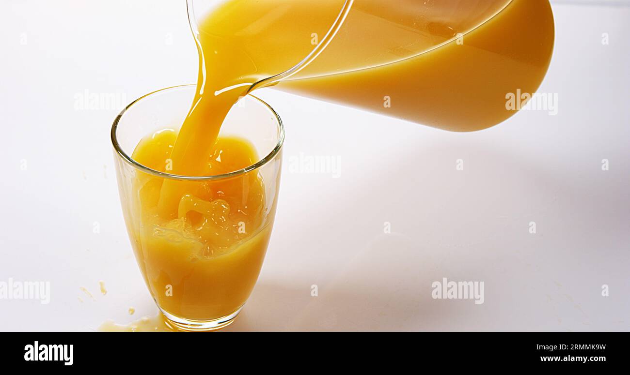 Orange juice poured drinking glass hi-res stock photography and images ...