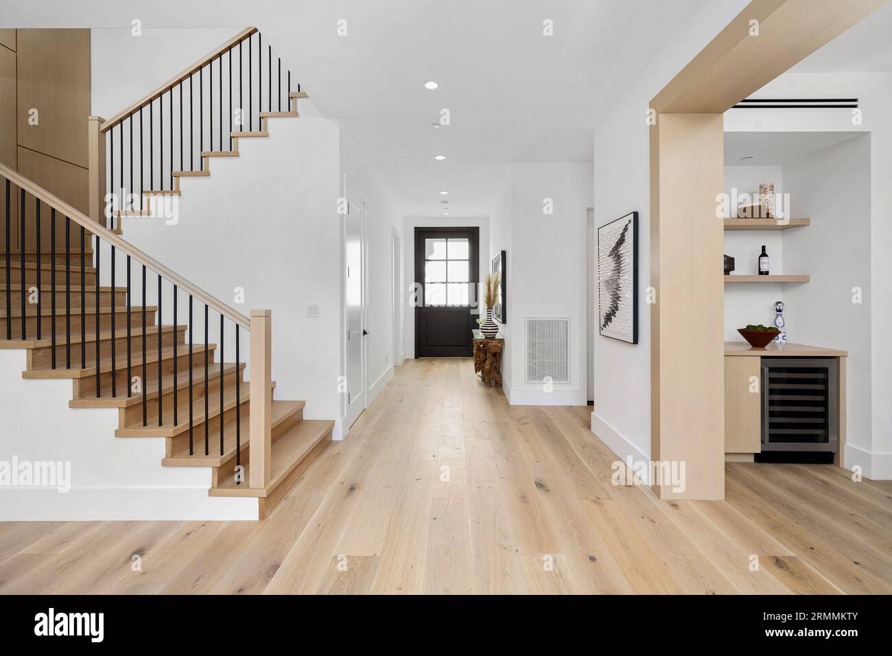 An elegant staircase with two flights of steps leading to the second ...