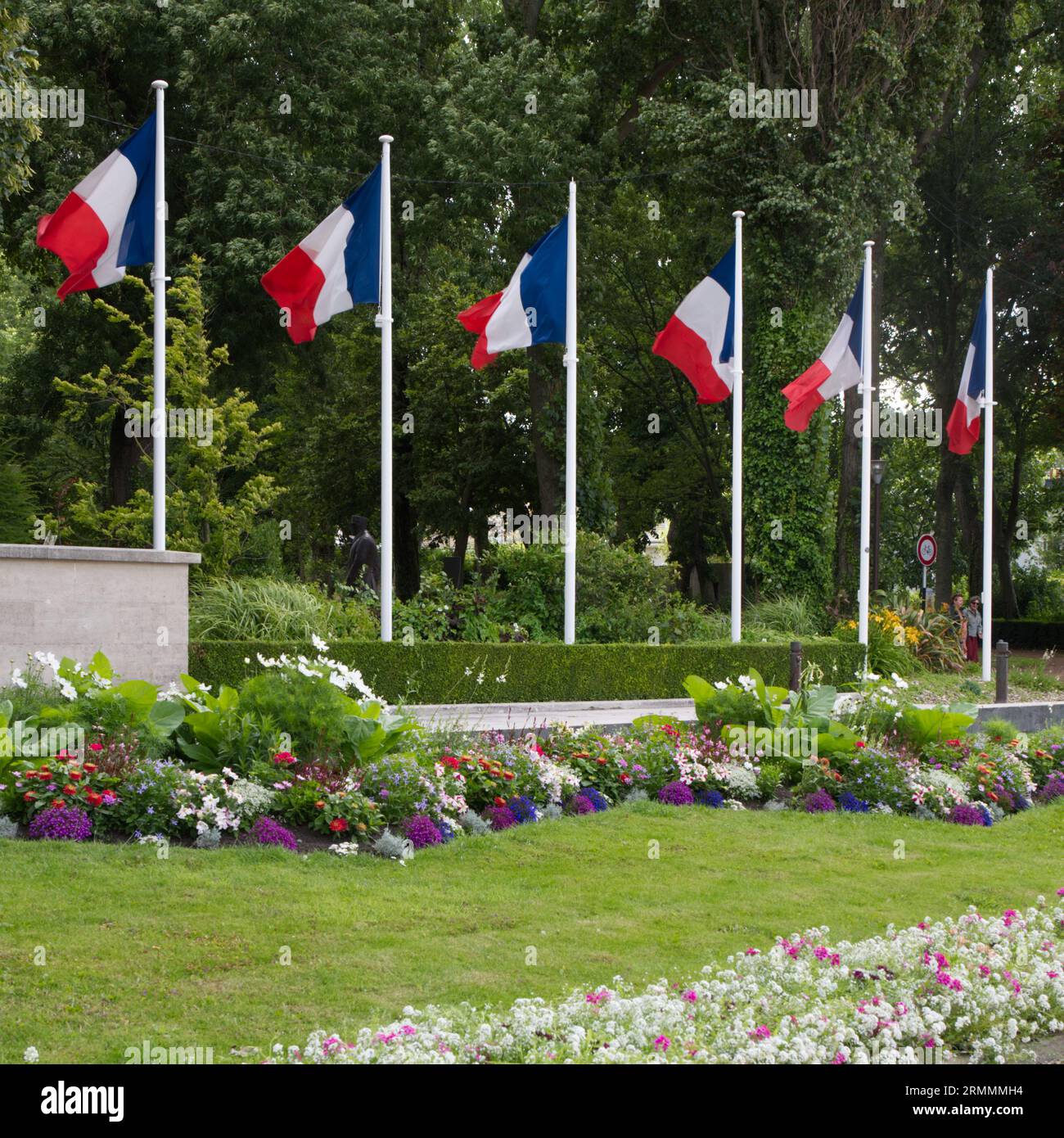French flags on war memorial to the dead of Calais, Place du Maréchal ...