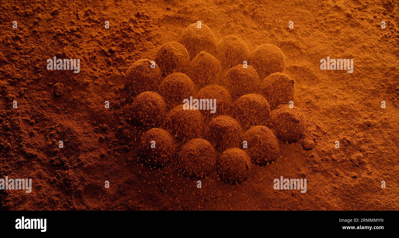 Chocolate Powder falling on Chocolate Truffles Stock Photo - Alamy