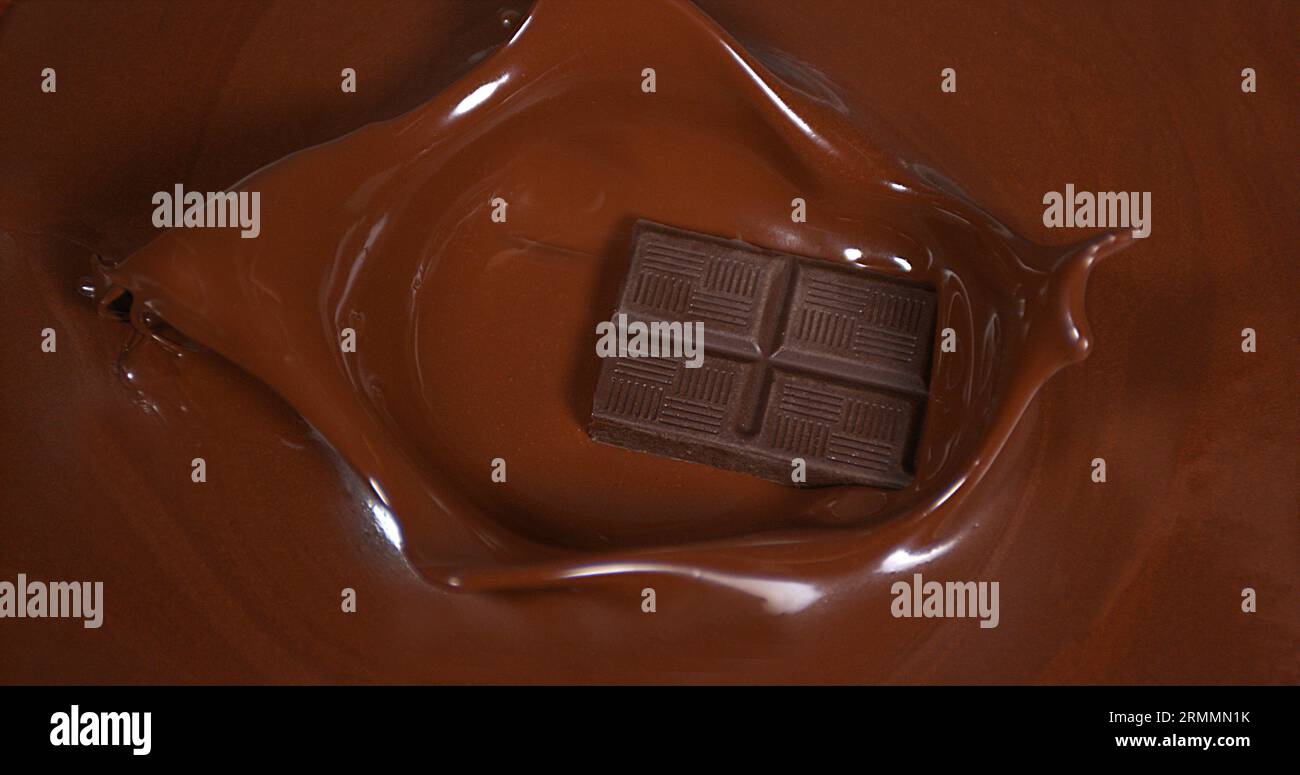 Black Chocolate tablet falling into Milk Chocolate Stock Photo - Alamy