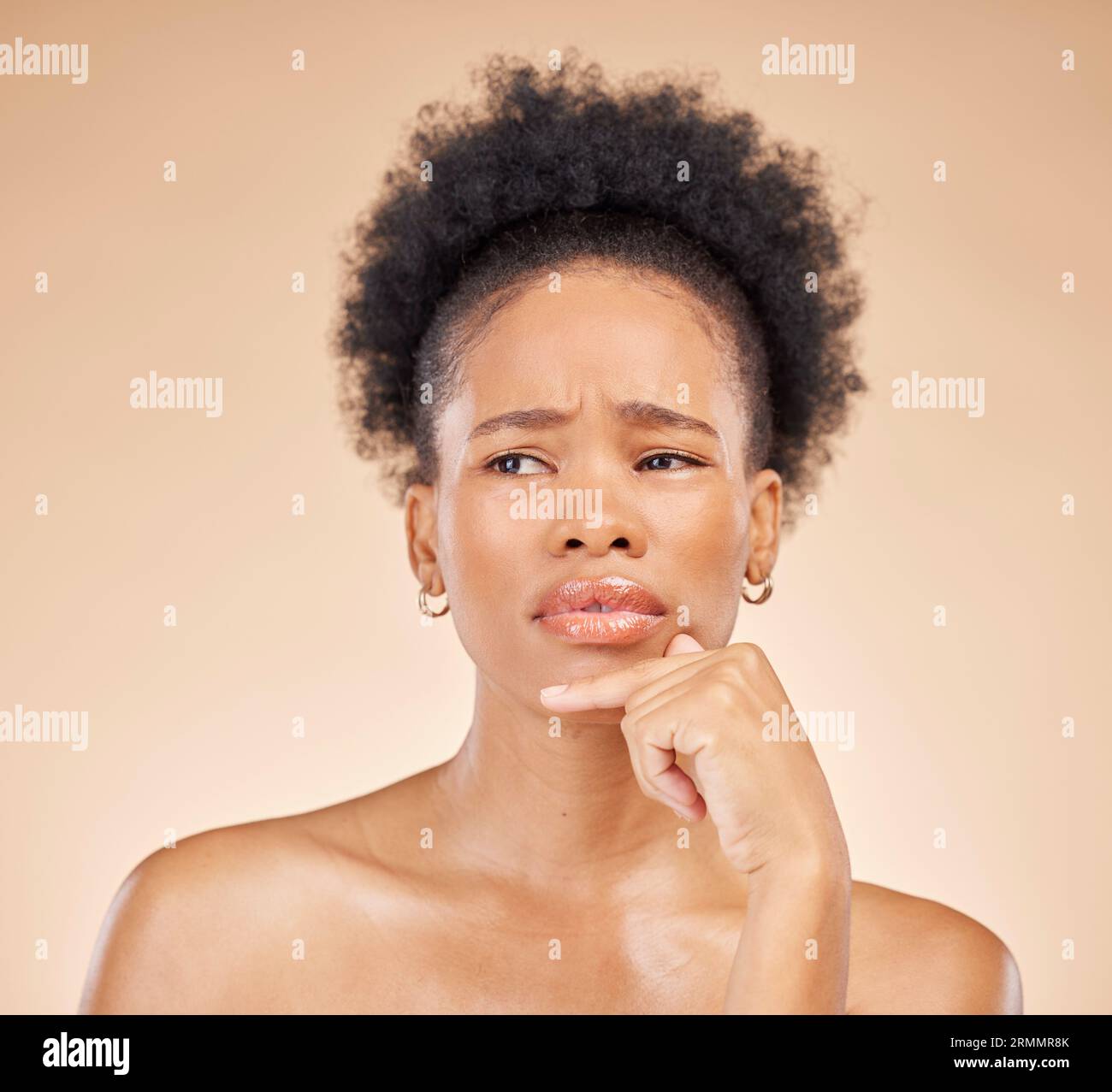 Skincare, choice and black woman in thinking in studio with choice ...