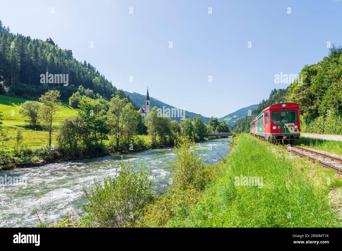 Ramingstein: church Ramingstein, Murtalbahn railcar operated by ...