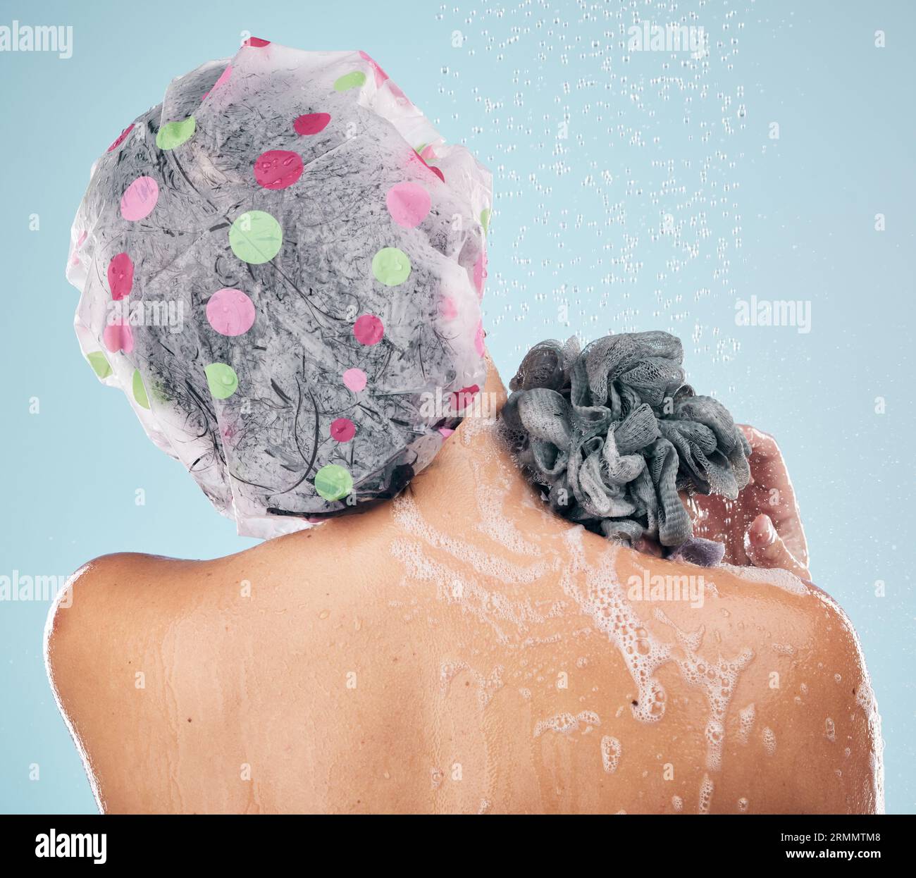 Person, shower and back in water drops for hygiene, grooming or washing ...