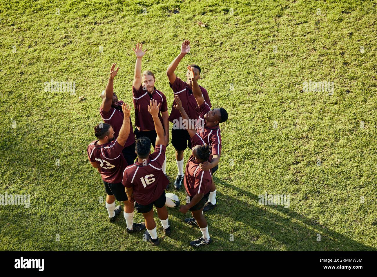 Raised hand, sports and rugby people celebrate teamwork, team building ...