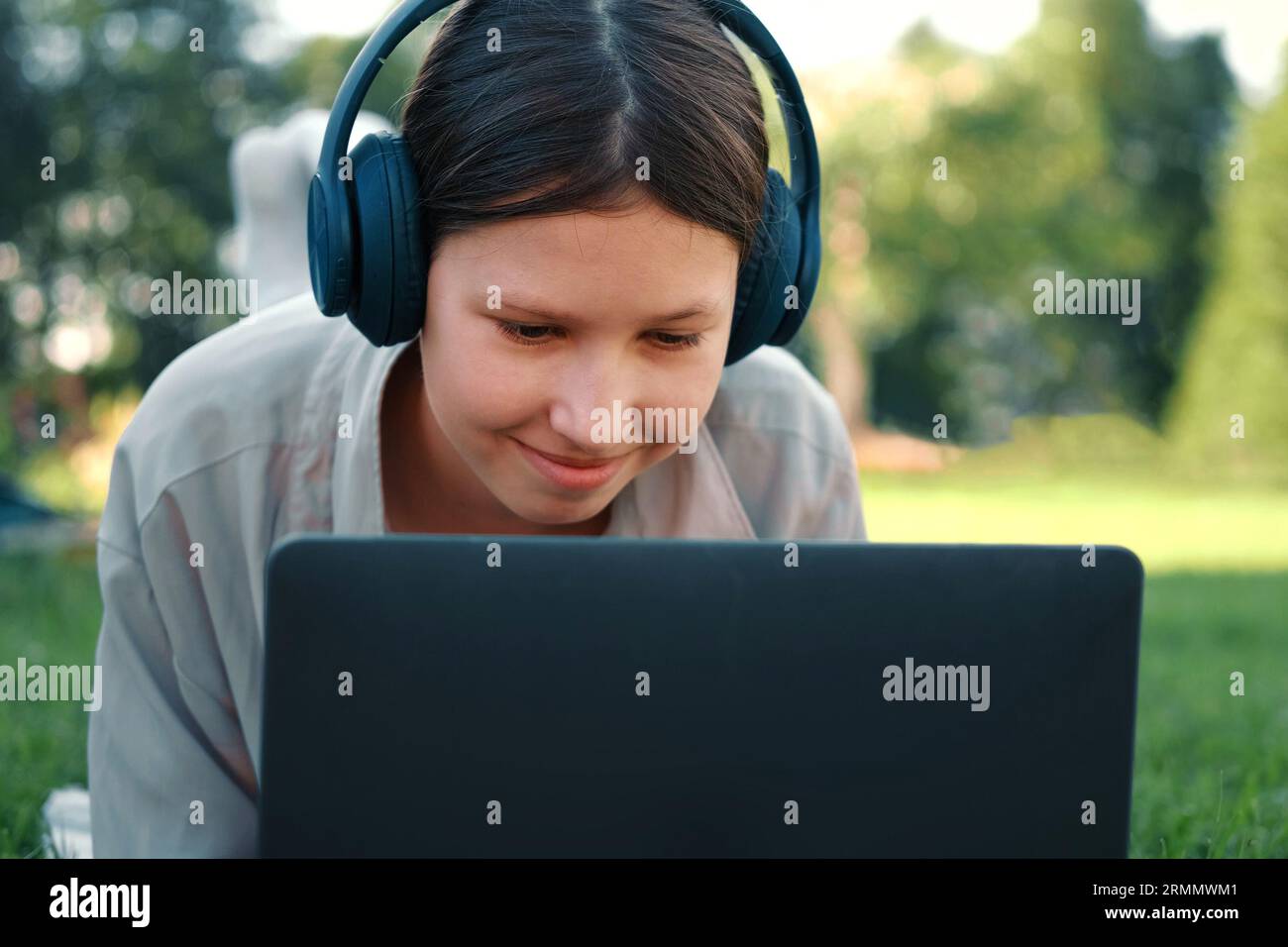 Teenage schoolgirl studying reading her books, tablet and notebook ...