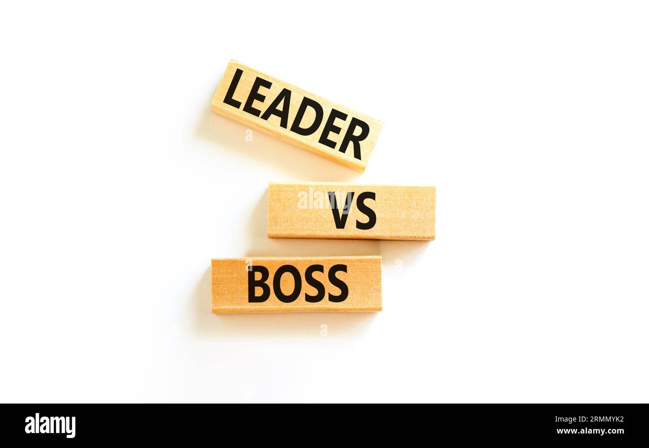 Boss vs leader symbol. Concept words Boss vs versus leader on wooden ...
