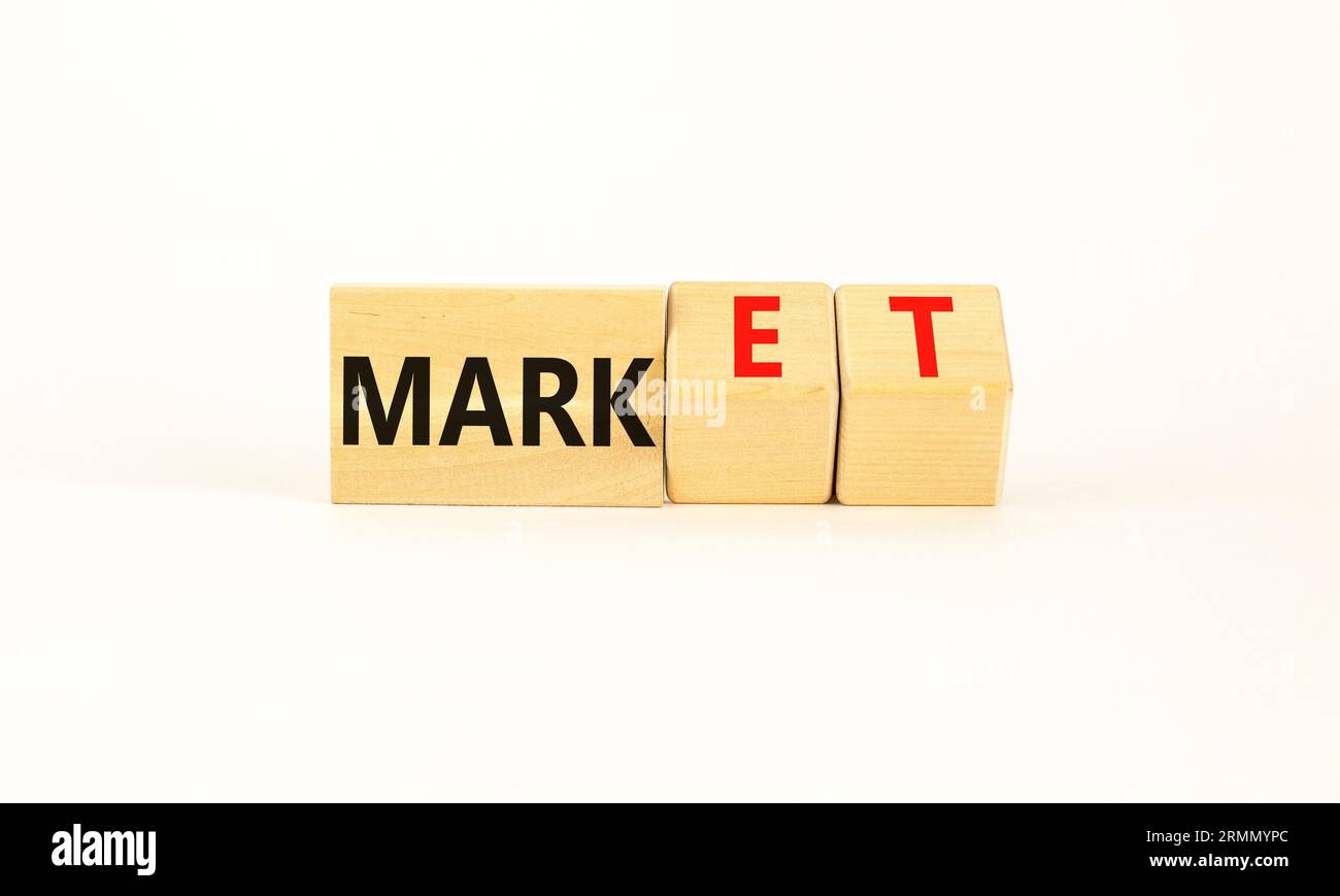 Mark of market symbol. Businessman turns wooden cubes and changes word ...