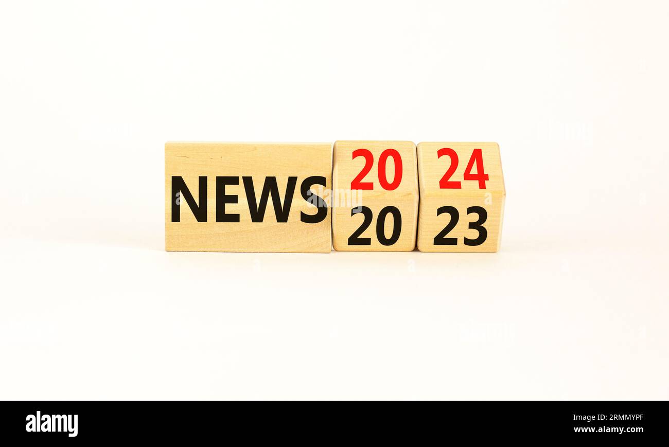 2024 News new year symbol. Businessman turns a wooden cube and changes ...