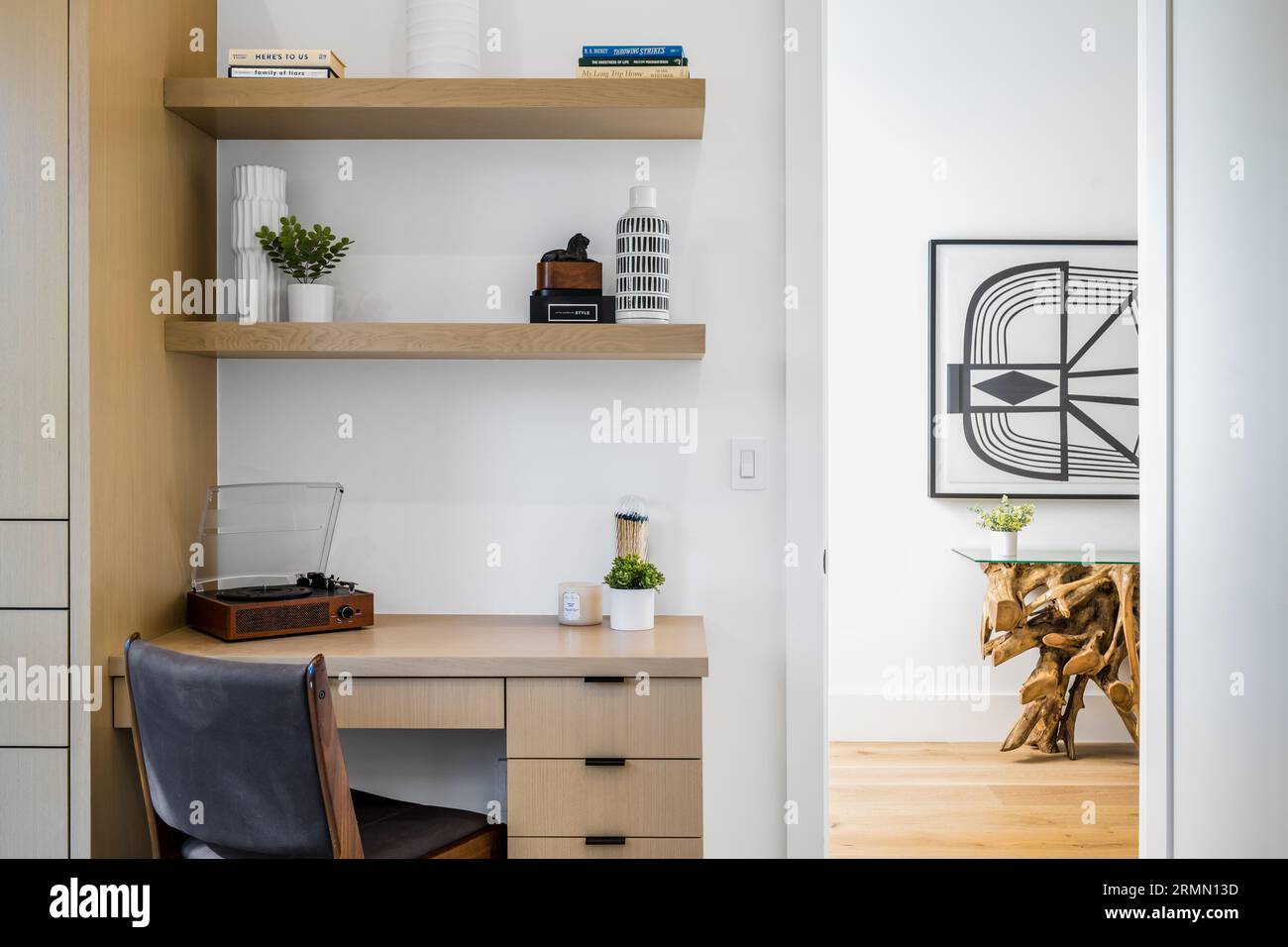 A contemporary looking wooden office desk with storage shelves on the ...