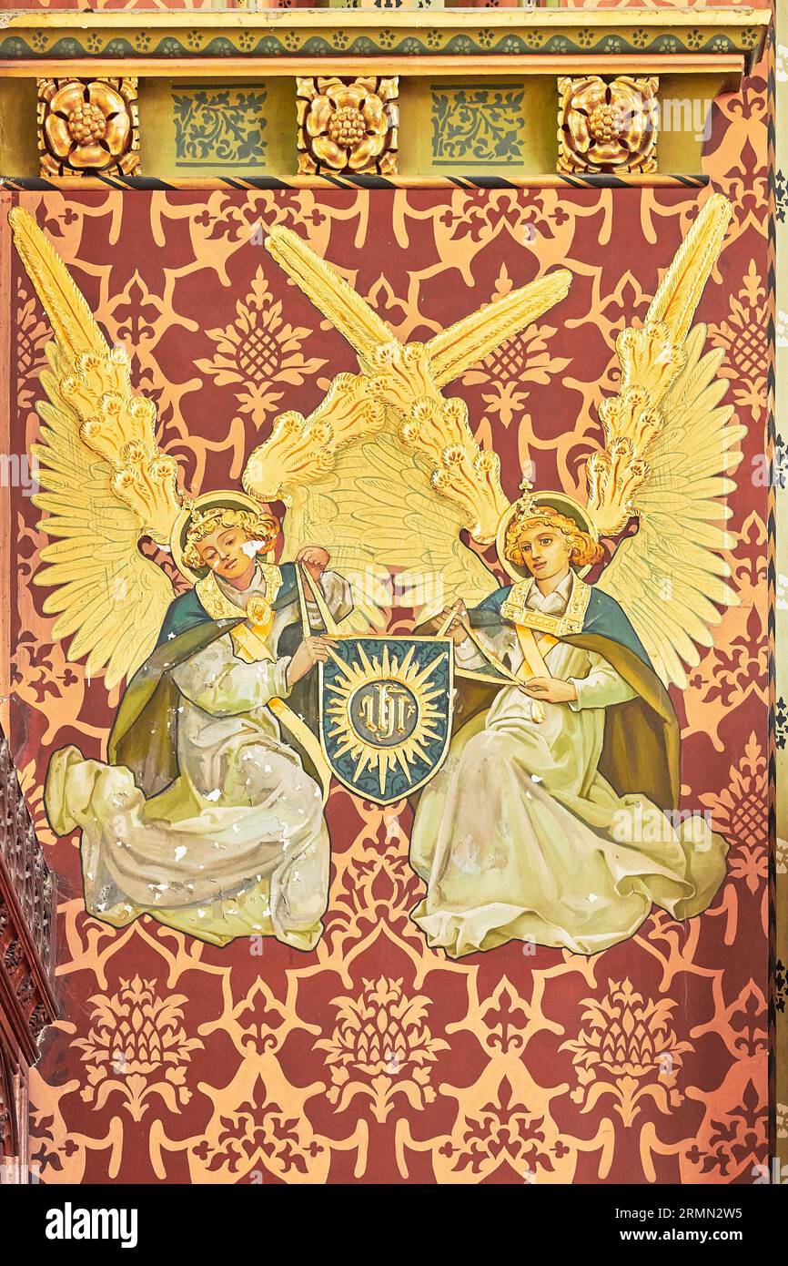 Painting of a pair of angels (holding a badge with the monogram IHS) in ...