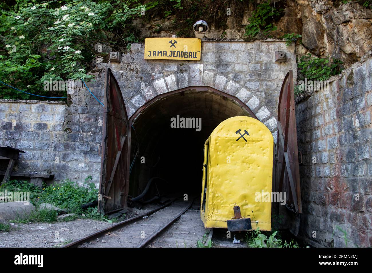 Entry gate to coal mine, leading deep into the earth. Mine shaft of the ...