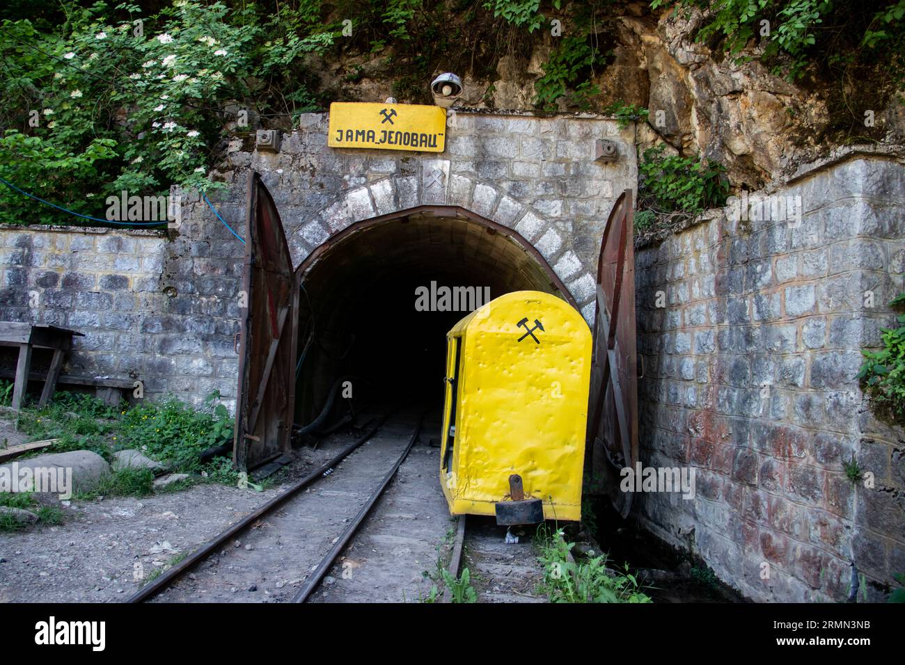 Entry gate to coal mine, leading deep into the earth. Mine shaft of the ...