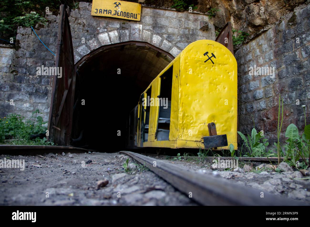 Entry gate to coal mine, leading deep into the earth. Mine shaft of the ...