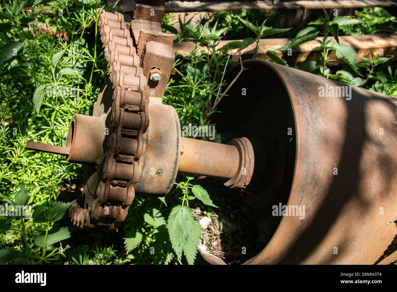 Rusty driving gears with metallic chain on a old mine train wagon for ...