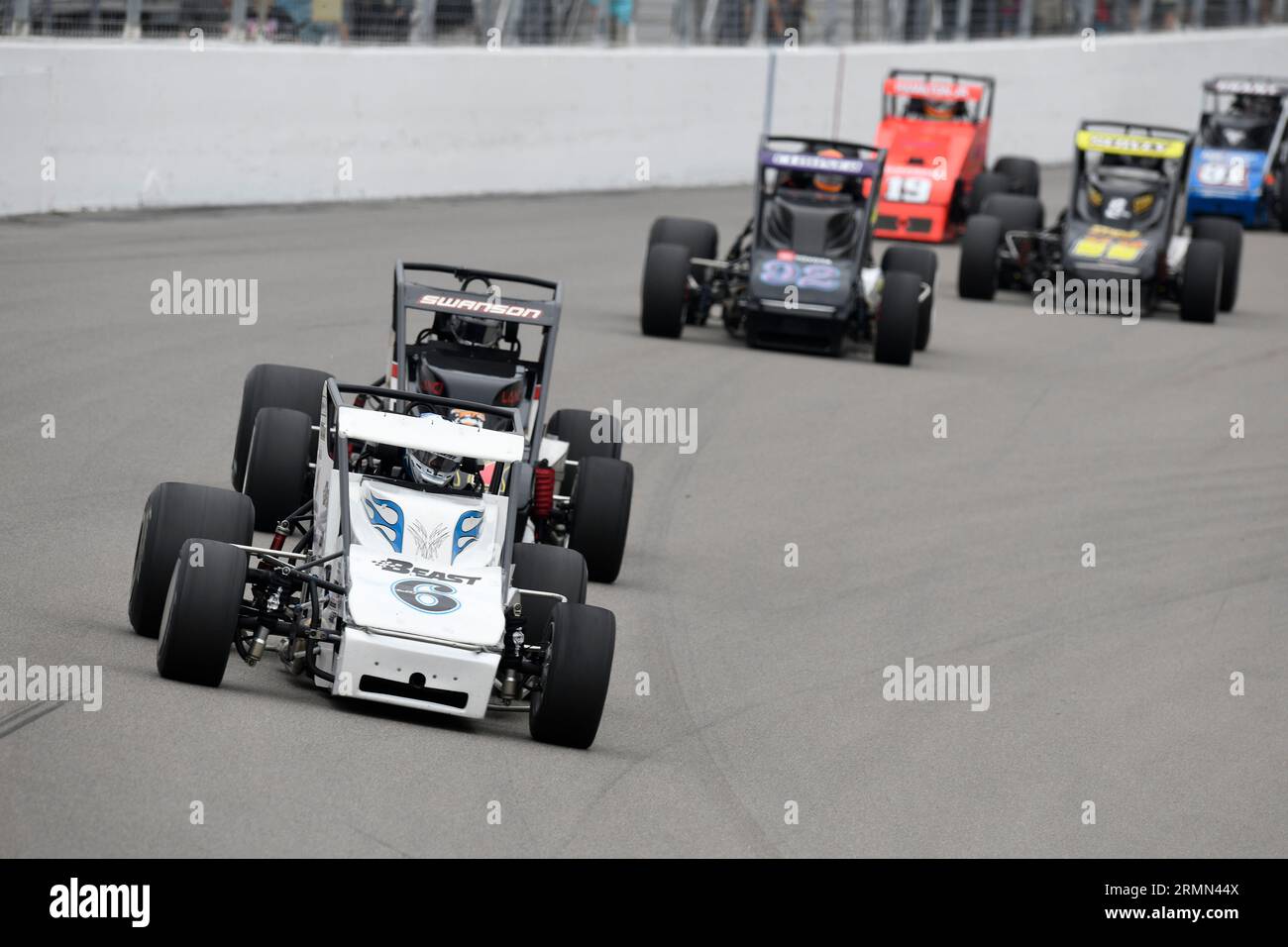 MADISON, IL - AUGUST 27: CJ Leary (6) leads the field into turn one ...