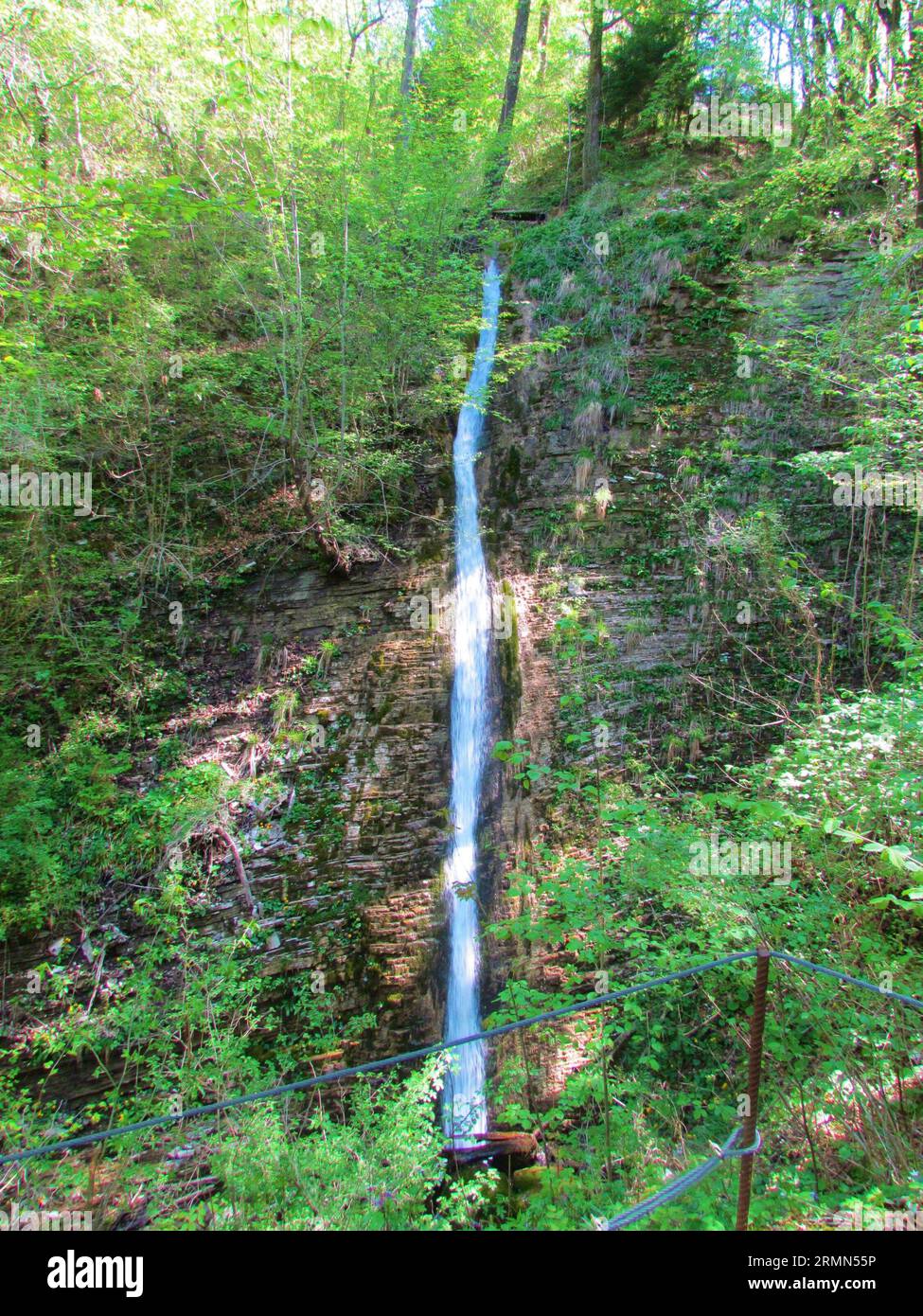 Long narrow Stopnik waterfall at Koseska Korita municipality of Kobarid ...