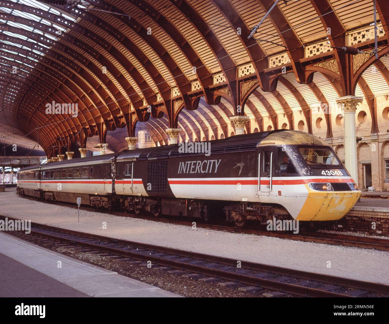 Intercity train at a station Stock Photo - Alamy