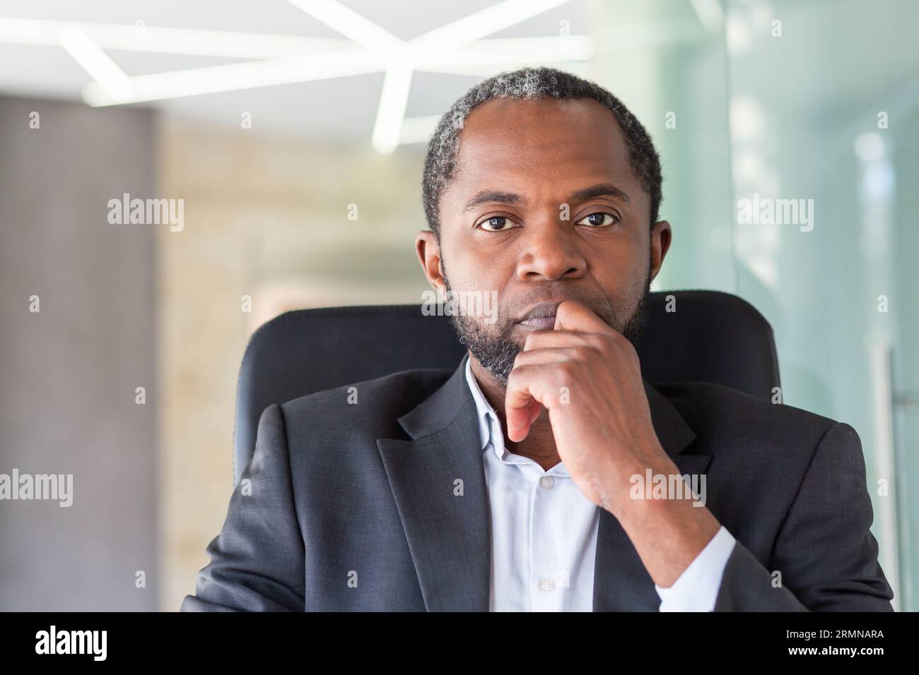 Powerful businessman in suit hi-res stock photography and images - Alamy