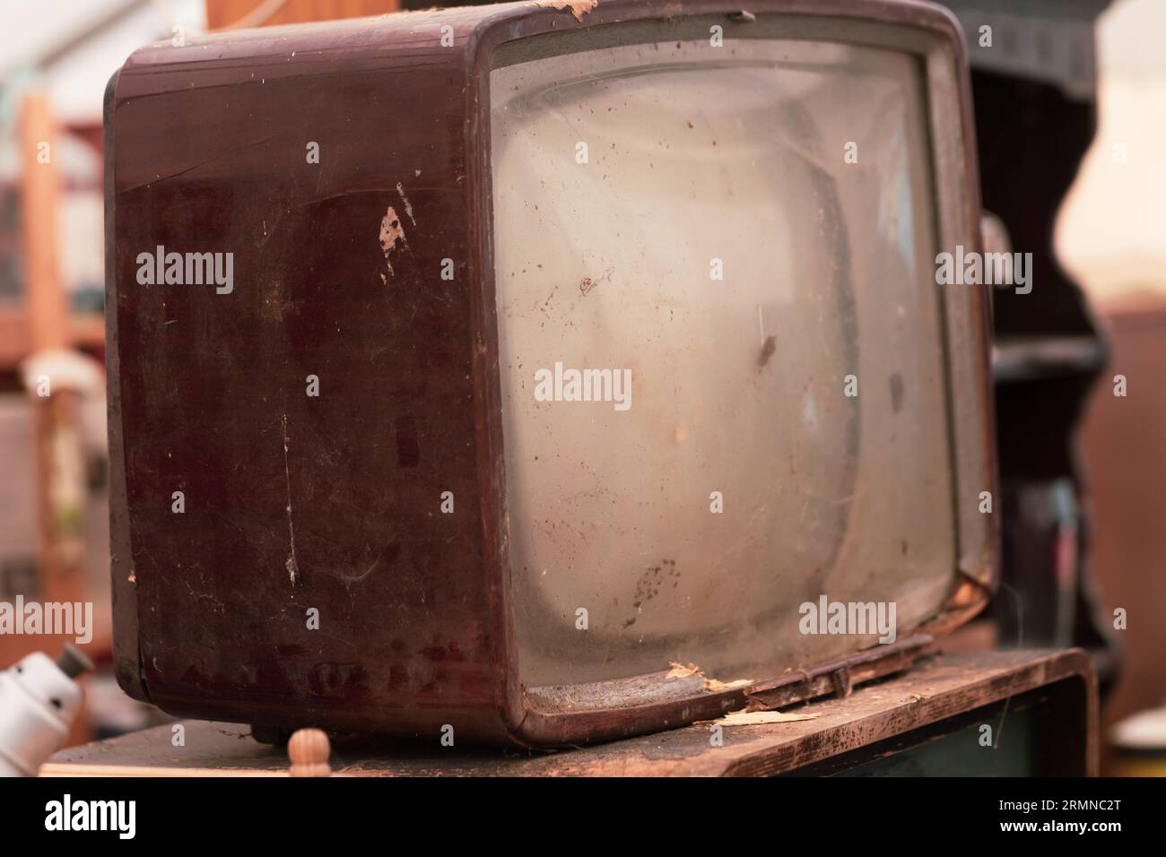 Old antique television with wooden surround covered in dust laying on ...