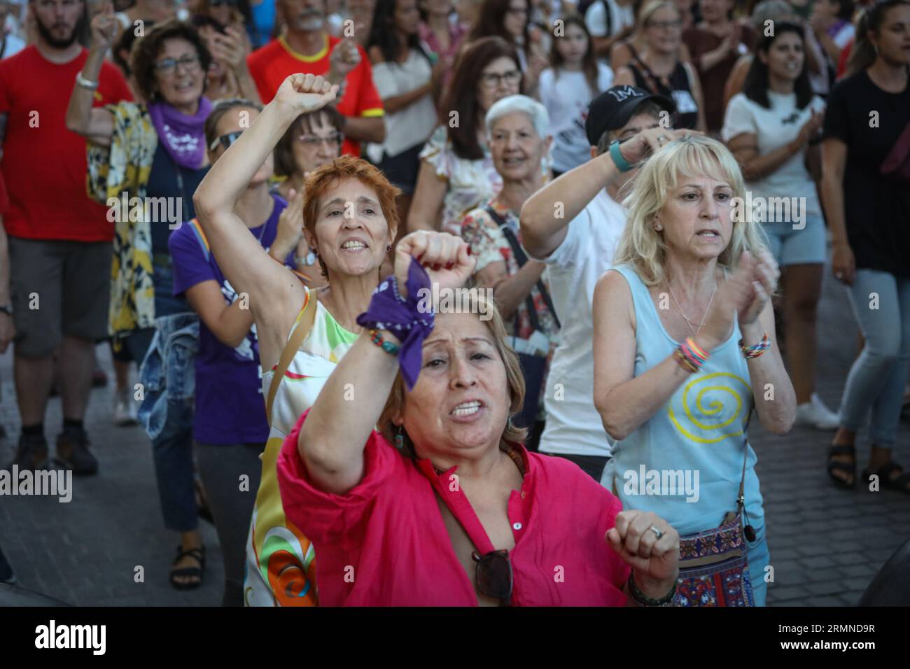A group of women chant slogans during the demonstration. Hundreds of ...