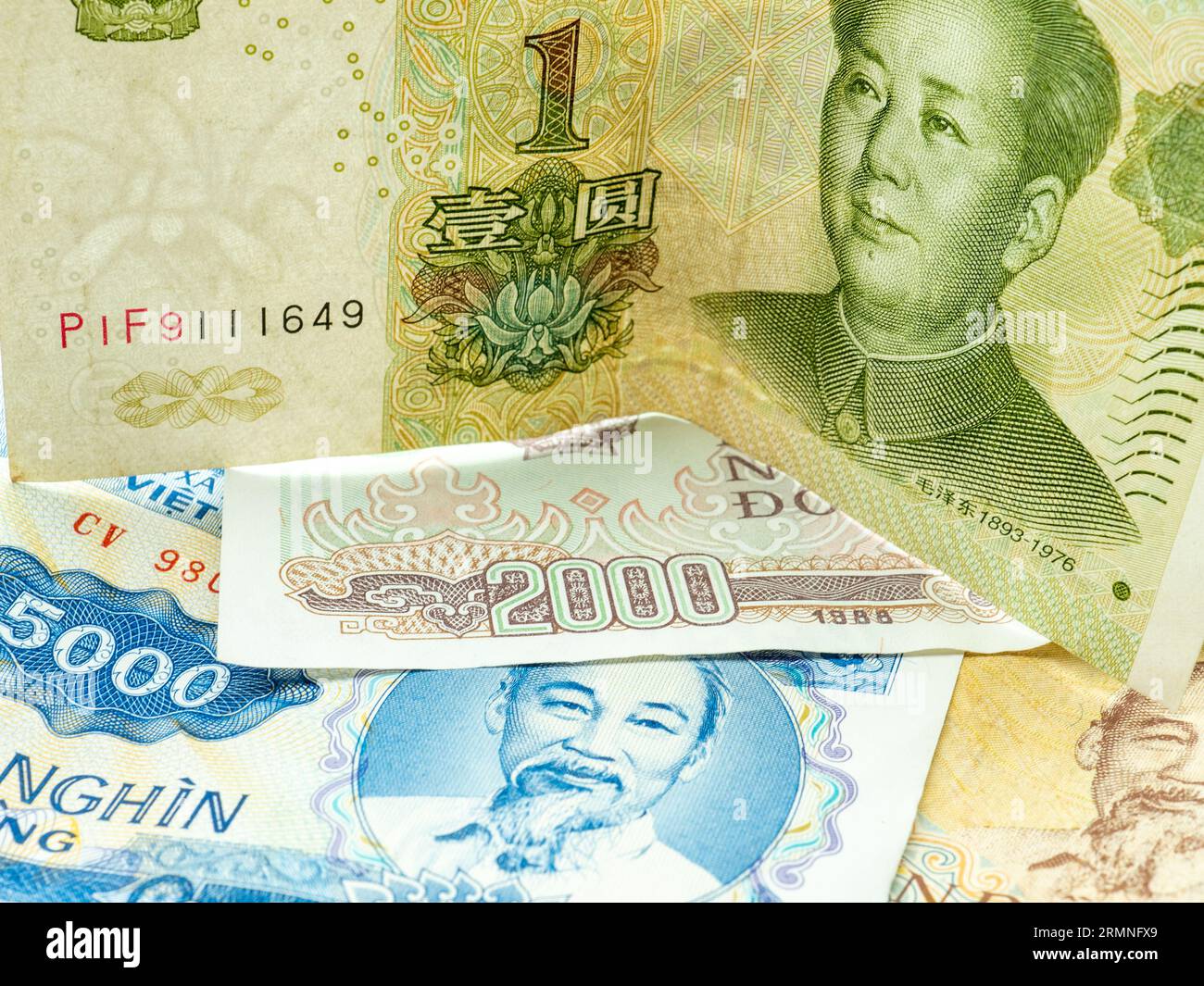 Vietnamese dong and Chinese yuan renminbi bank notes, trade financial ...