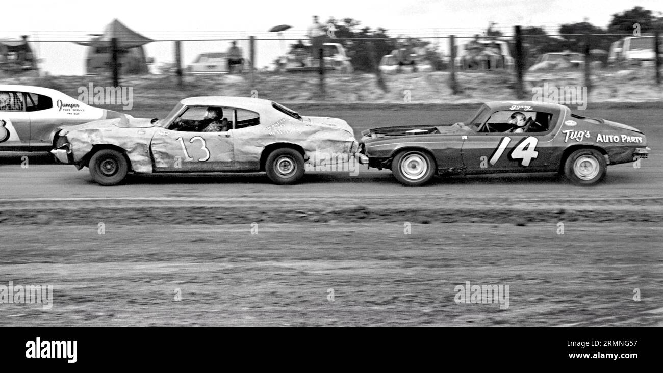 Weekend amateur stock car race drivers negotiate the dirt track at ...