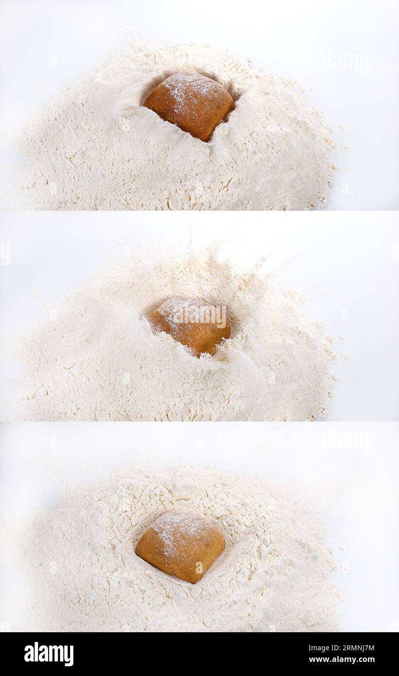 Bread Falling in Flour against White Background Stock Photo - Alamy