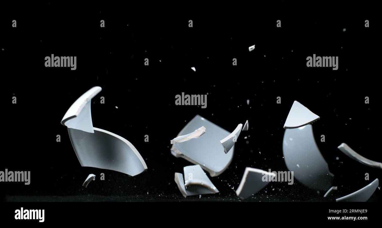 Bowl falling and exploding on Black Background Stock Photo - Alamy