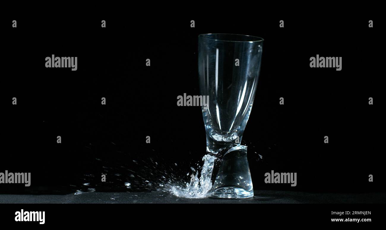 Glass Falling and exploding on Black Background Stock Photo - Alamy