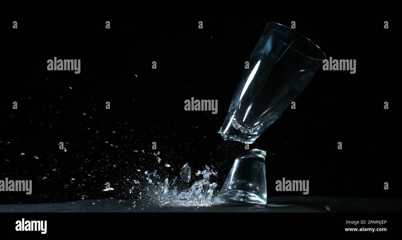 Glass Falling and exploding on Black Background Stock Photo - Alamy