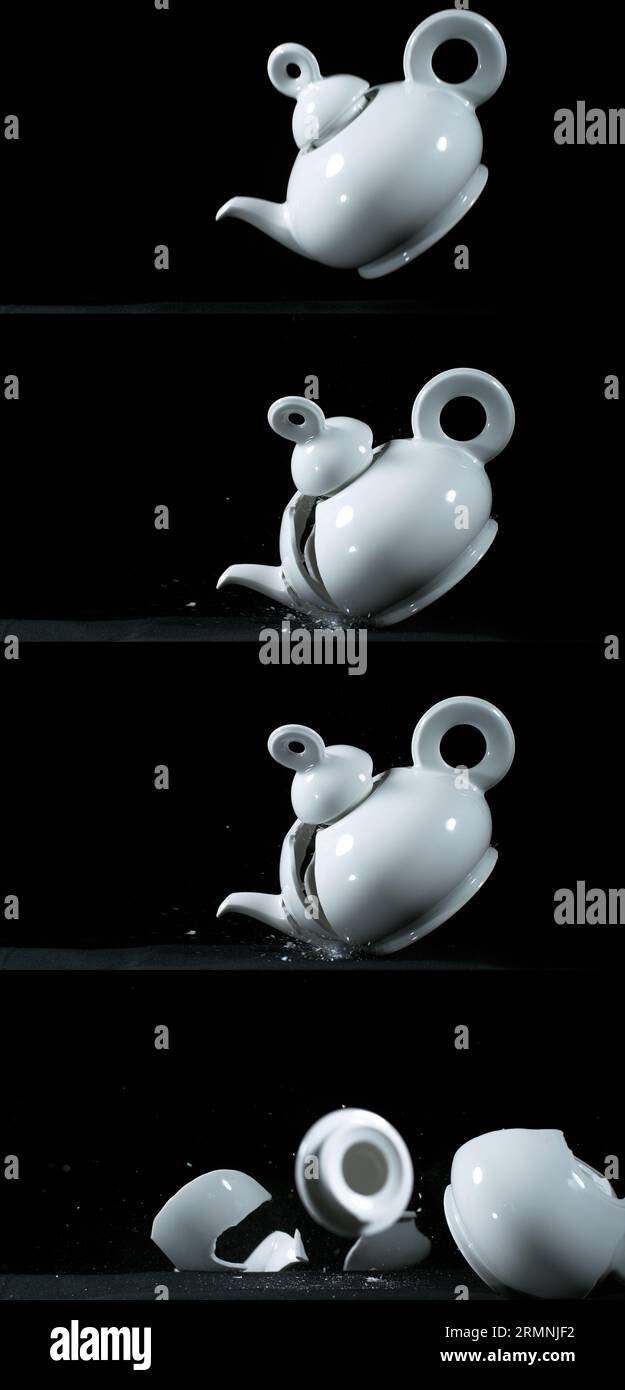 Tea-Pot falling and exploding on Black Background Stock Photo - Alamy