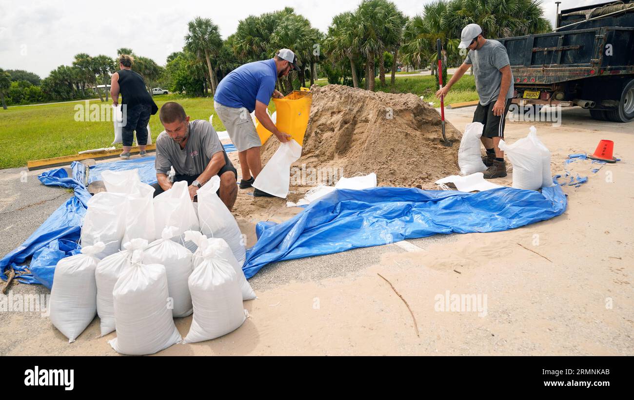Flagler County residents fill sand bags, Tuesday, Aug. 29, 2023, in ...