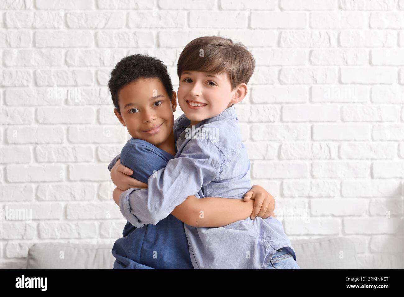 Cute little boys hugging at home Stock Photo - Alamy