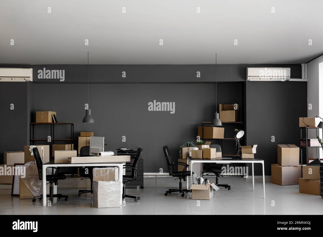 Interior of modern office with cardboard boxes on moving day Stock ...